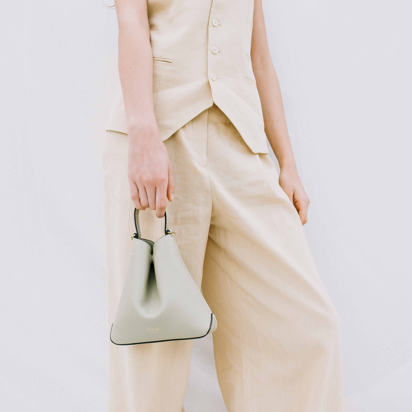 Mini Curve Bag in Pale Green Leather from STOW London